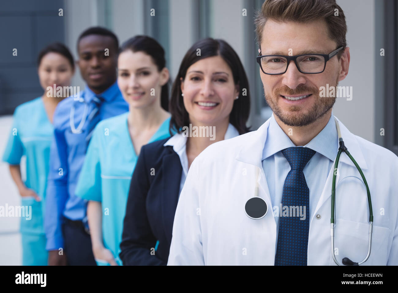 Team of doctors standing in row Stock Photo - Alamy