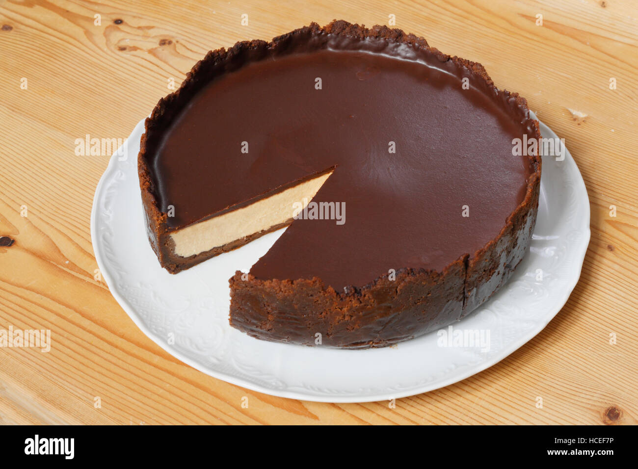Chocolate cheesecake on wooden desk Stock Photo - Alamy