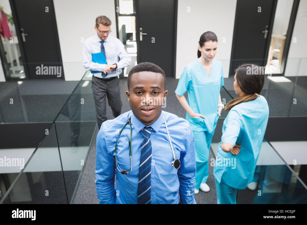 Mature female doctor standing hi-res stock photography and images - Alamy