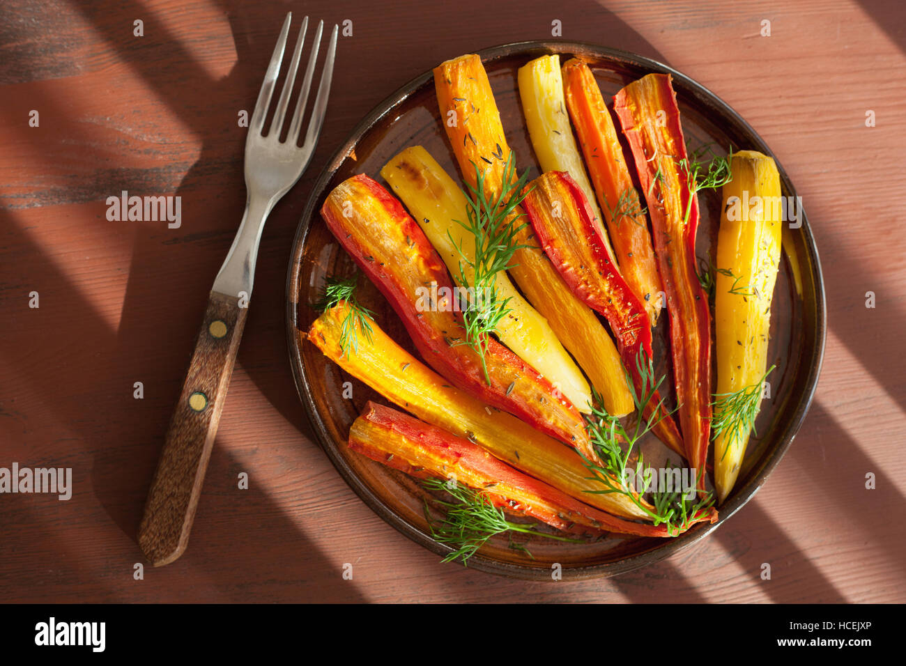 roasted colorful carrots on plate Stock Photo - Alamy