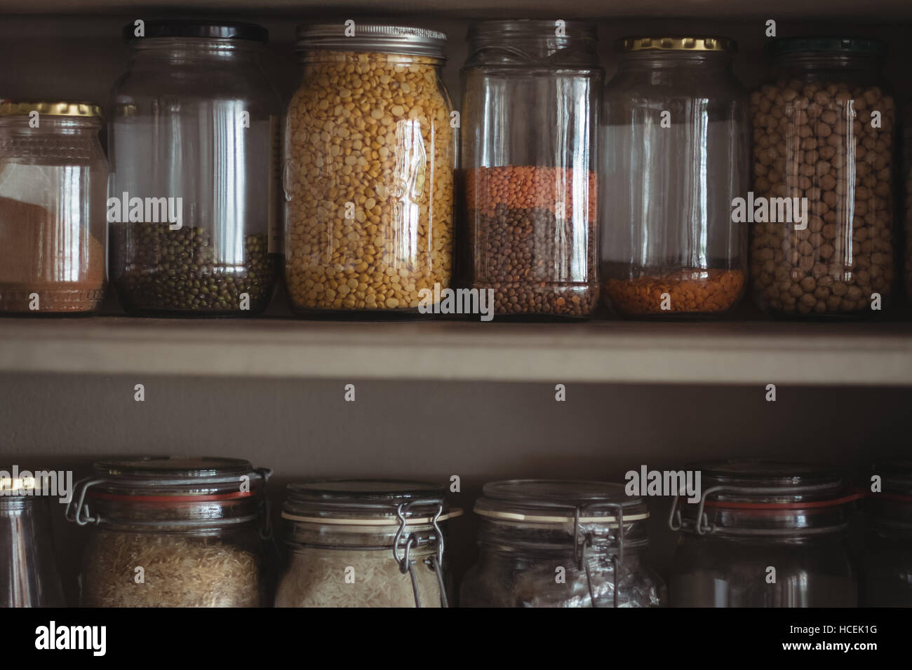 Various beans in jars in kitchen shelf Stock Photo - Alamy