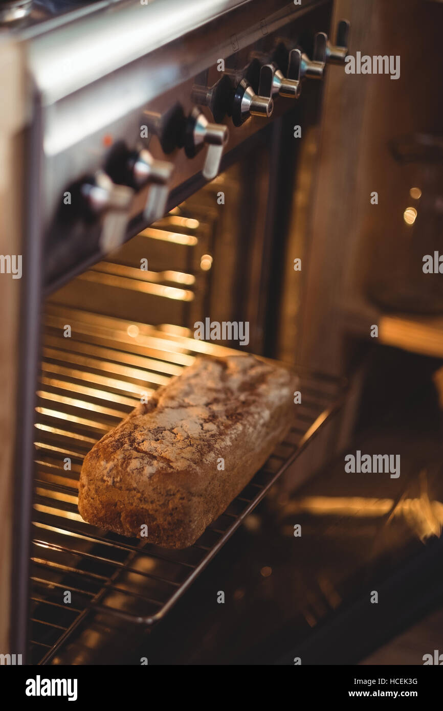Baked bread in oven Stock Photo - Alamy