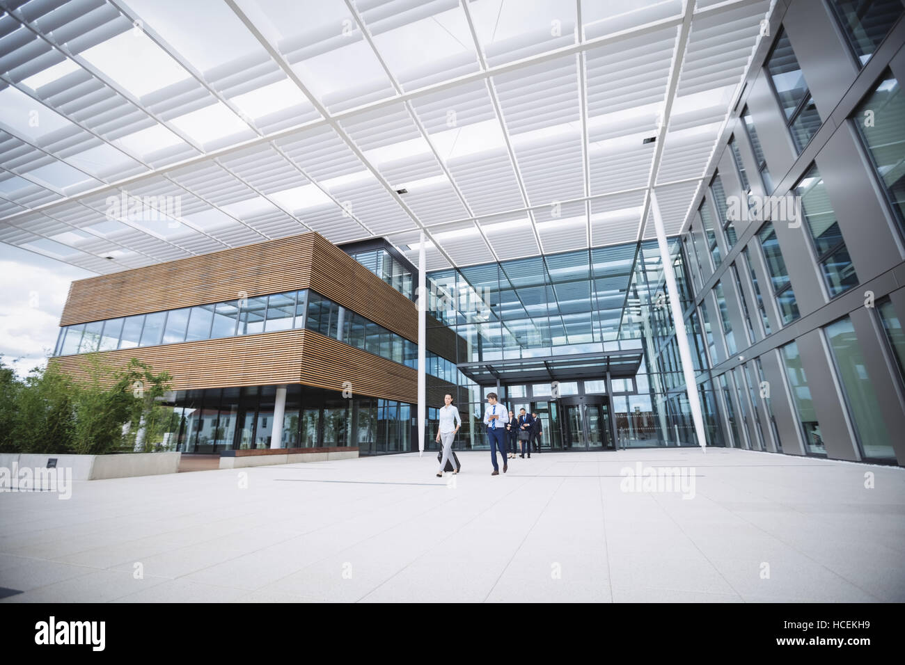 Business people walking outside office building Stock Photo - Alamy
