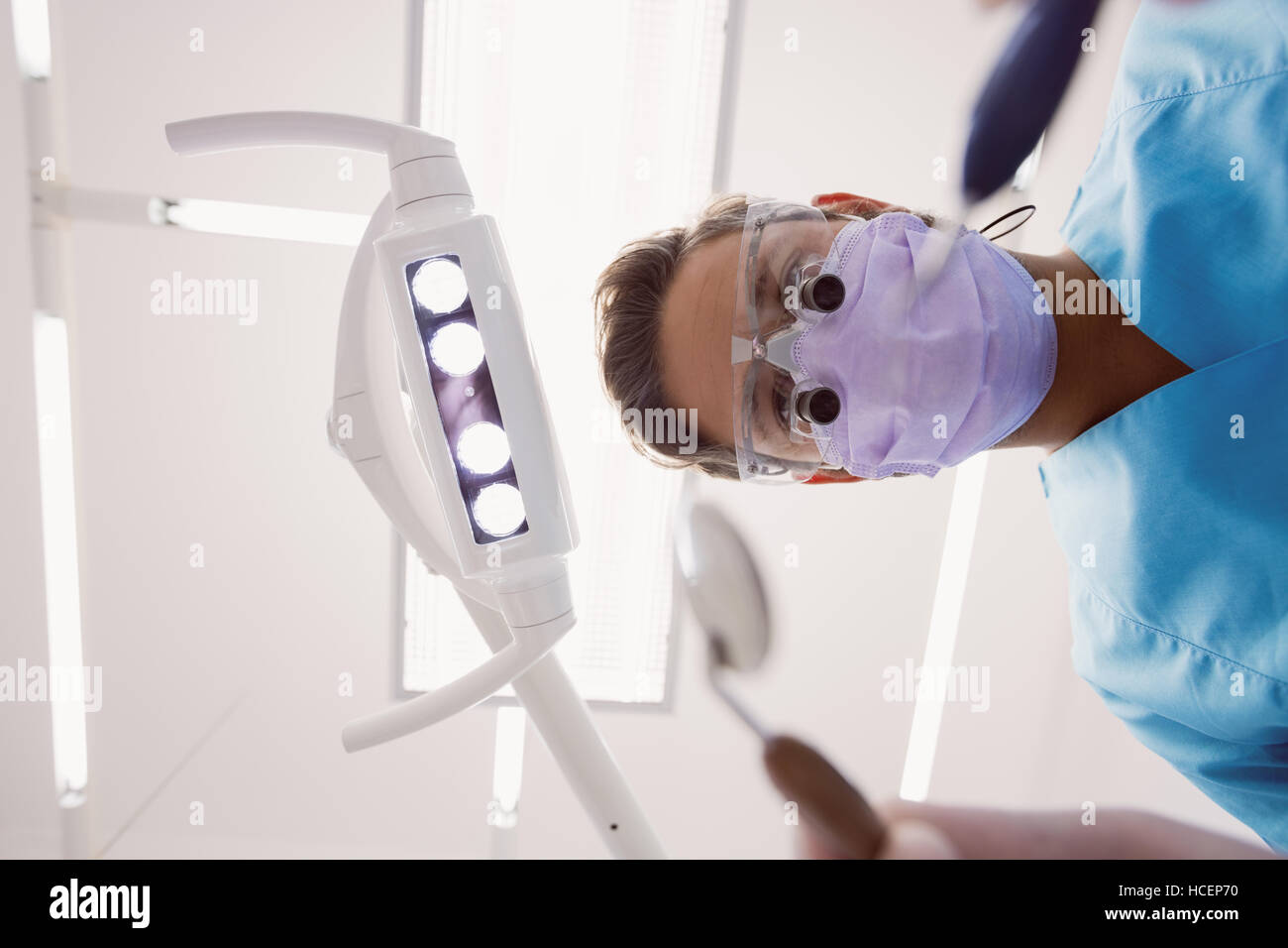Dentist holding dental tools Stock Photo - Alamy