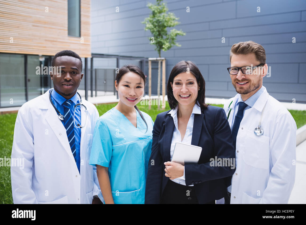 Team of doctors standing together in hospital premises Stock Photo - Alamy