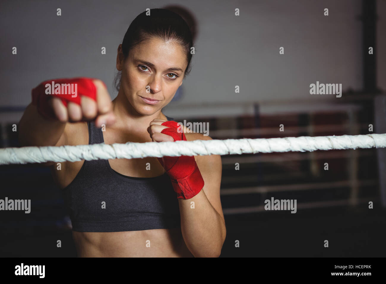 Confident female boxer performing boxing stance Stock Photo - Alamy