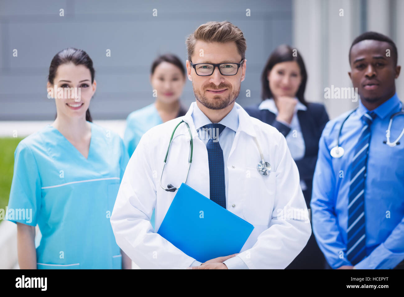 Team of doctors standing together in hospital premises Stock Photo - Alamy
