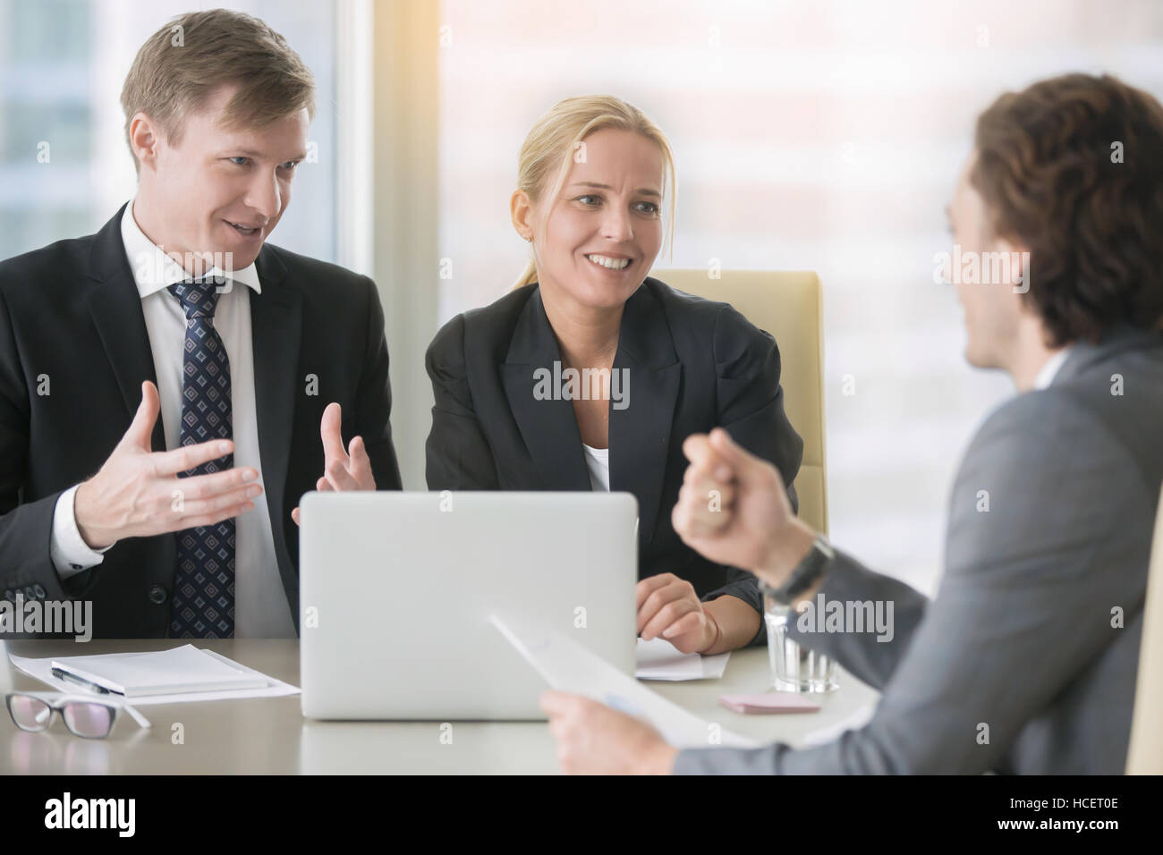 Businesspeople discussing proposal Stock Photo - Alamy
