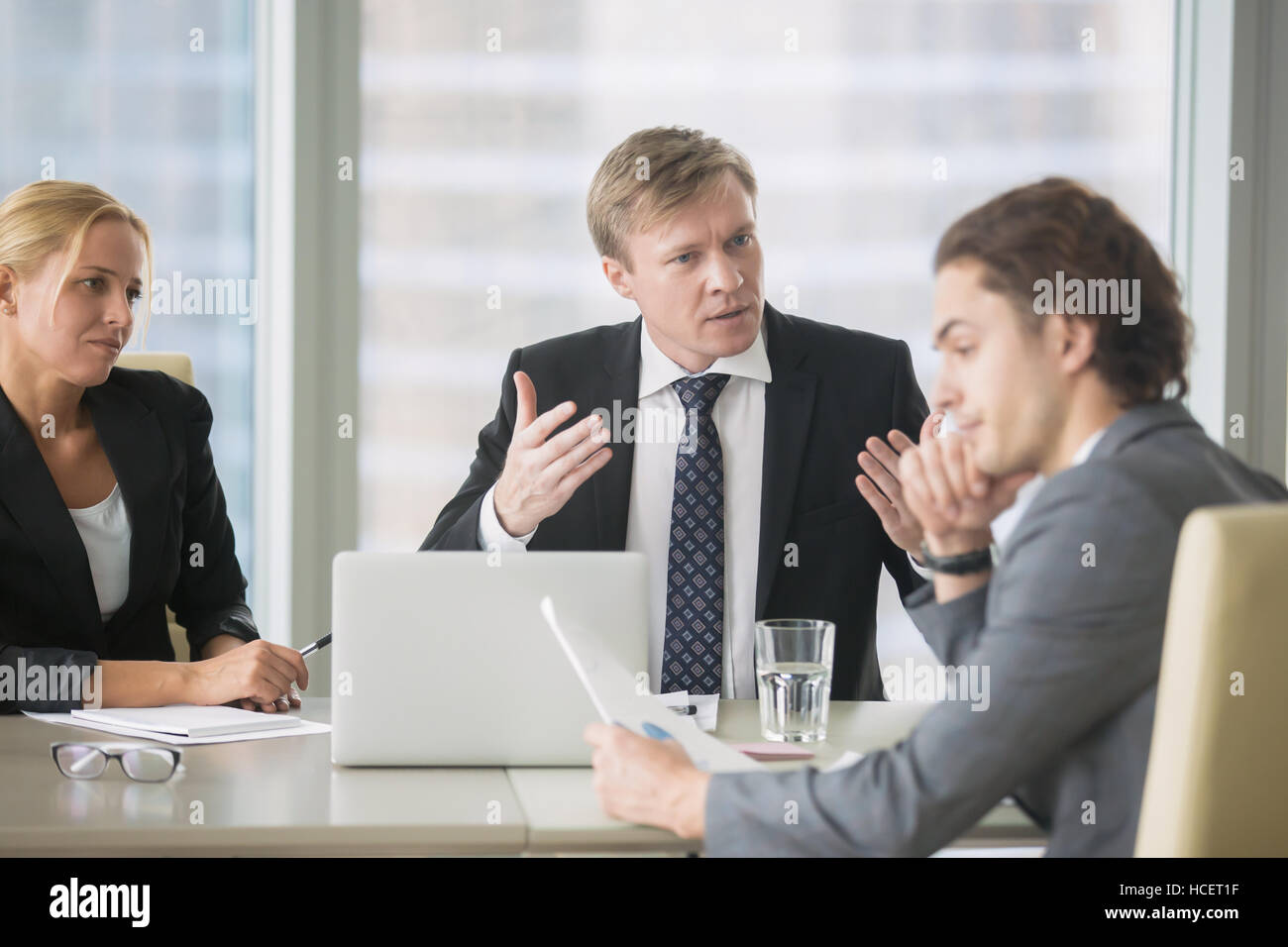 Boss nagging and dismissing intern Stock Photo - Alamy