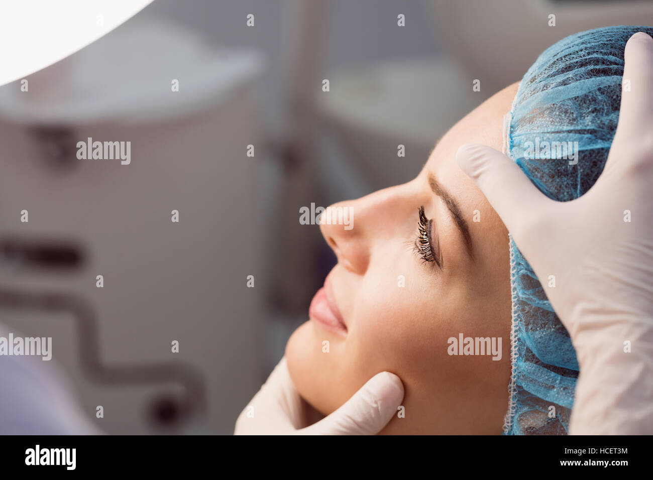 Doctor examining womans face for cosmetic treatment Stock Photo - Alamy