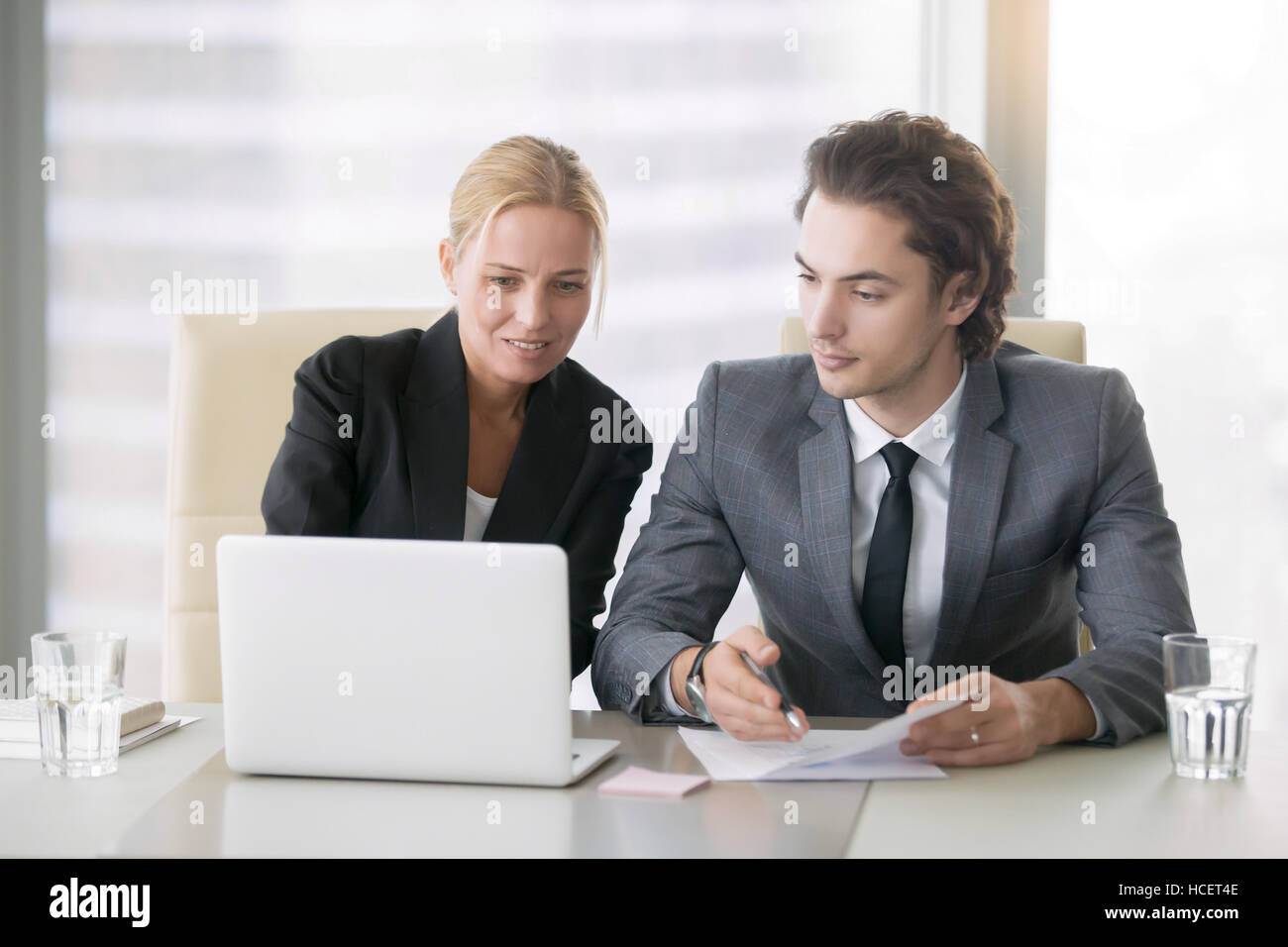 Business people discussing project plans hi-res stock photography and ...