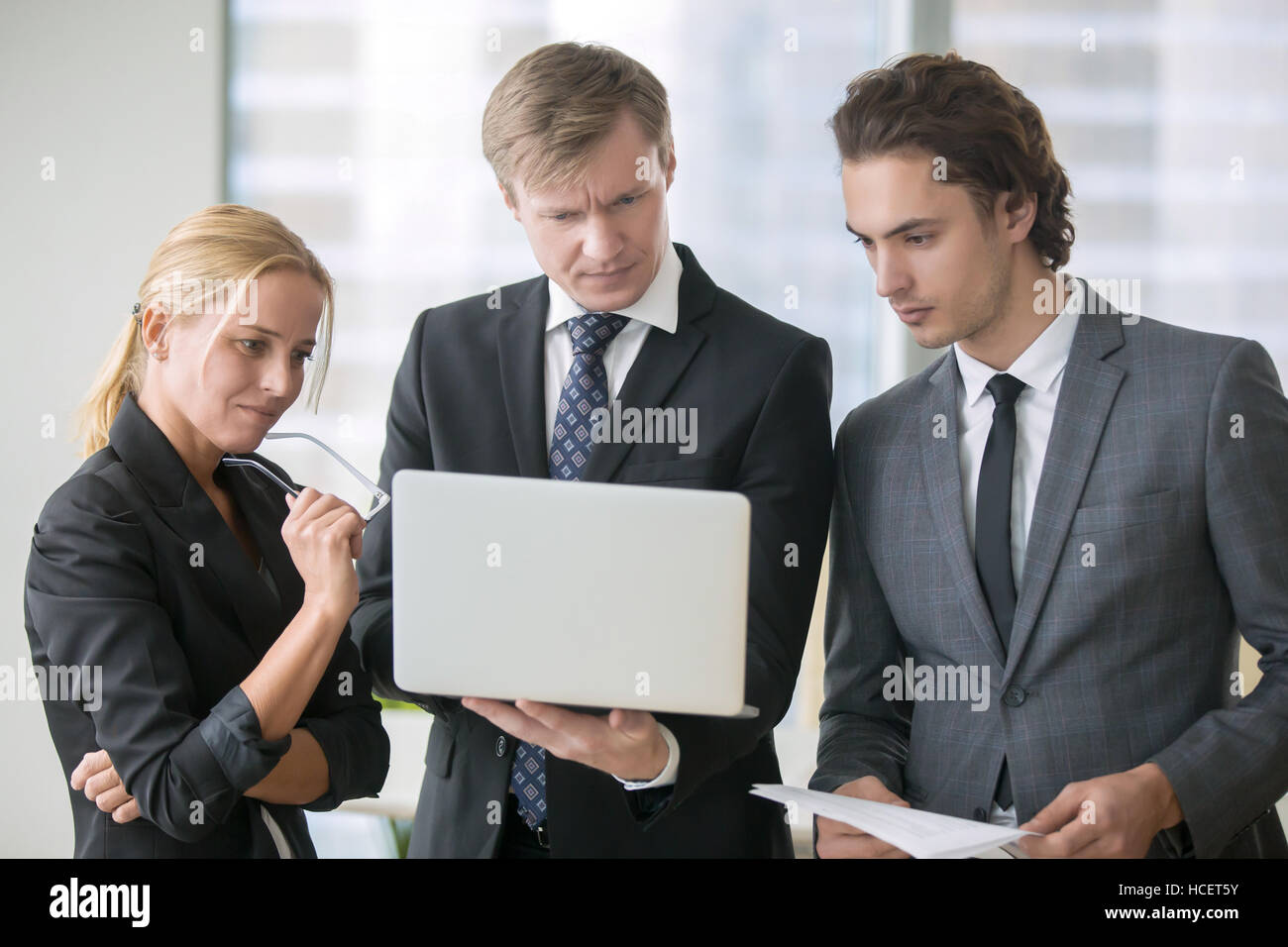 Team work on creative project Stock Photo - Alamy