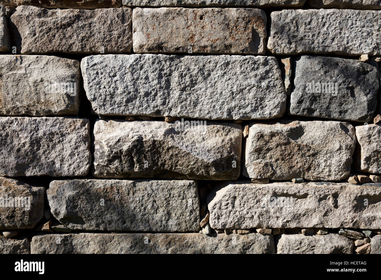 Granite block retaining wall Stock Photo - Alamy