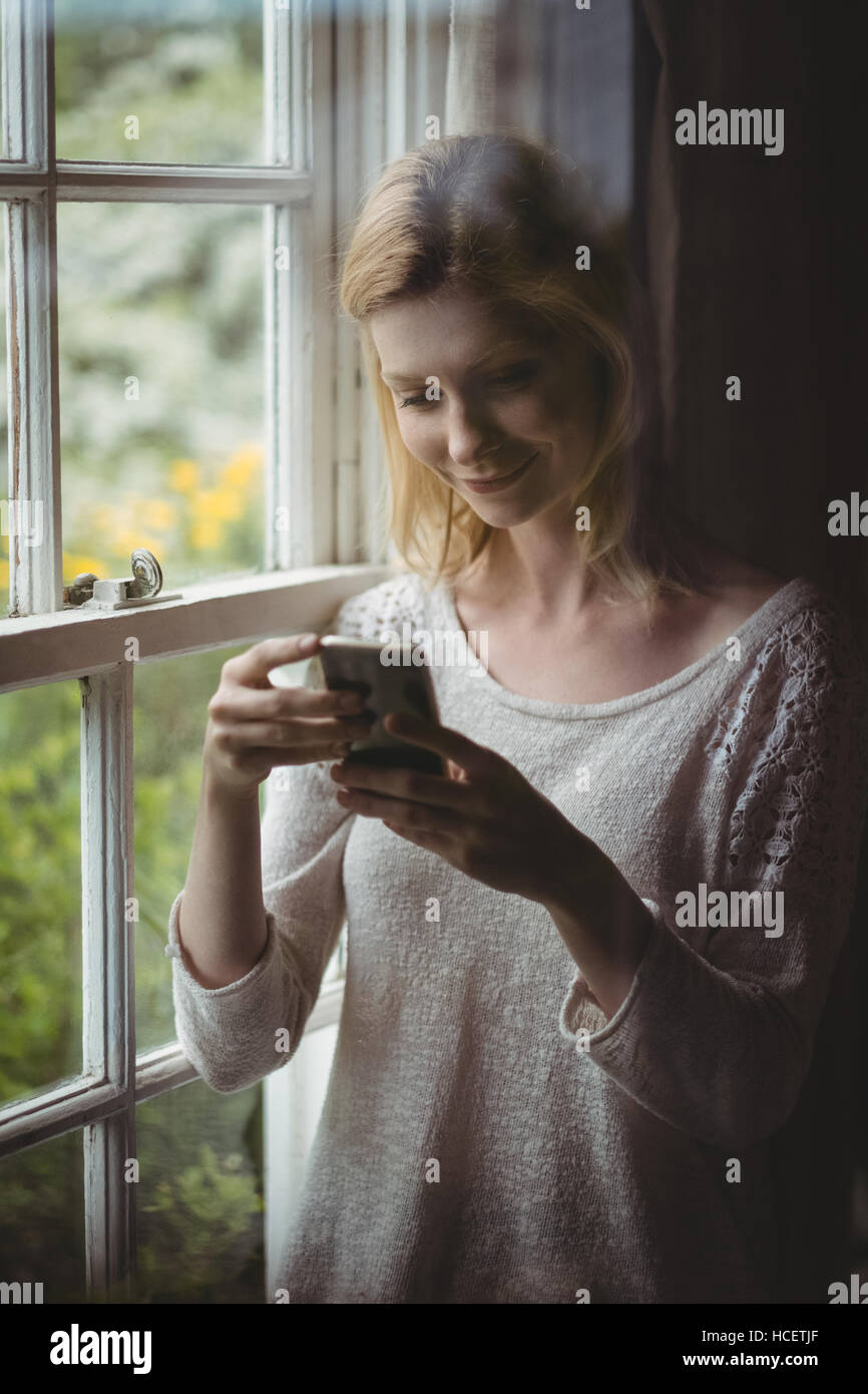 Woman standing window home beautiful woman hi-res stock photography and ...