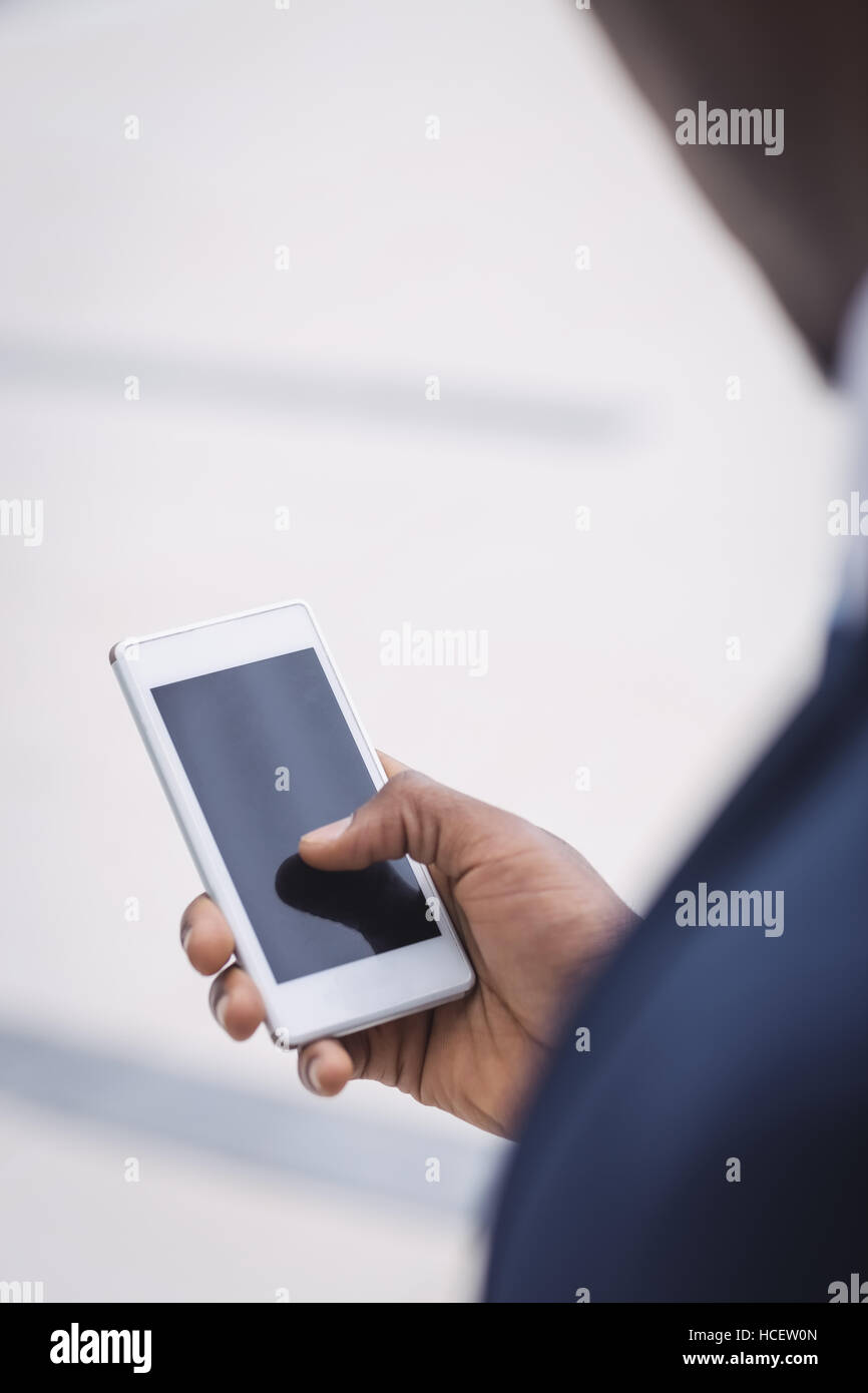 Businessman using mobile phone Stock Photo - Alamy