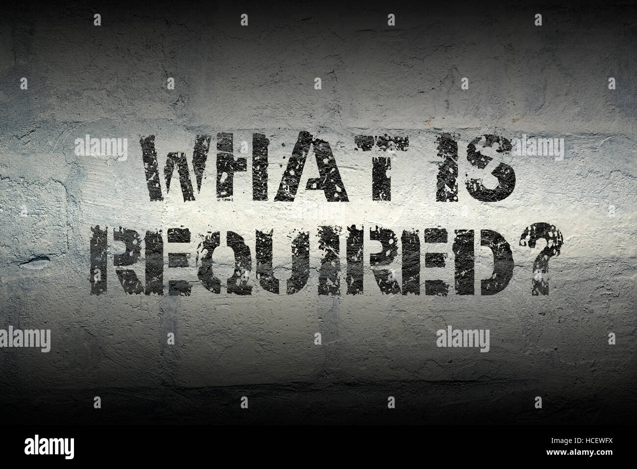 what is required question stencil print on the grunge white brick wall ...