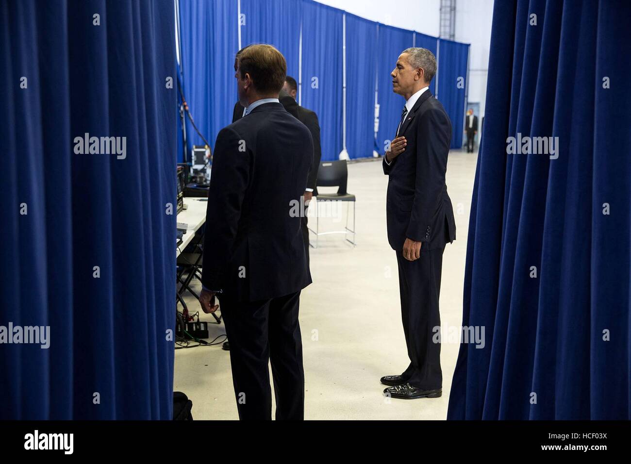 U.S President Barack Obama stands for the national anthem back stage ...