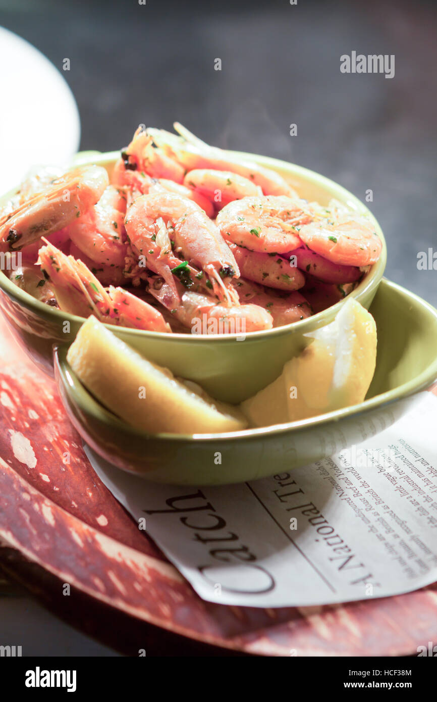 shell on prawns with lemon garlic and parsley Stock Photo - Alamy
