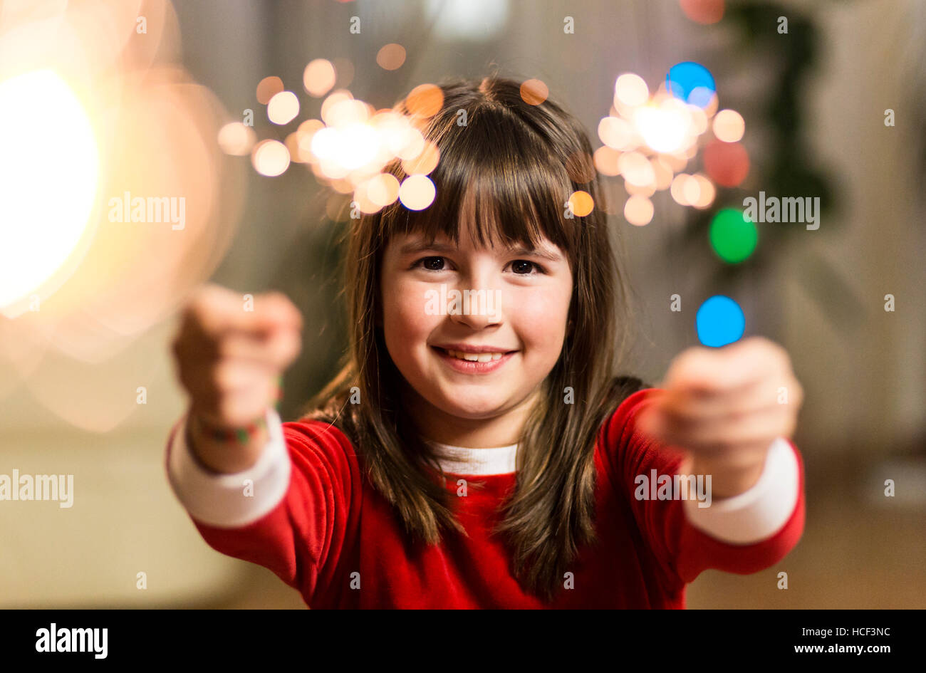 Girl Having Fun with Sparkler Stock Photo - Alamy