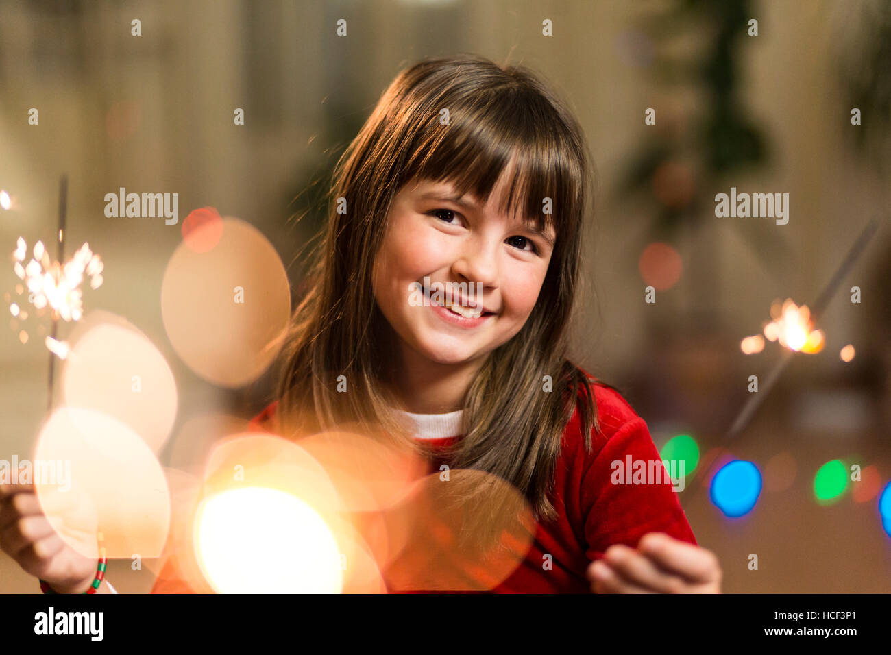 Girl Having Fun with Sparkler Stock Photo - Alamy