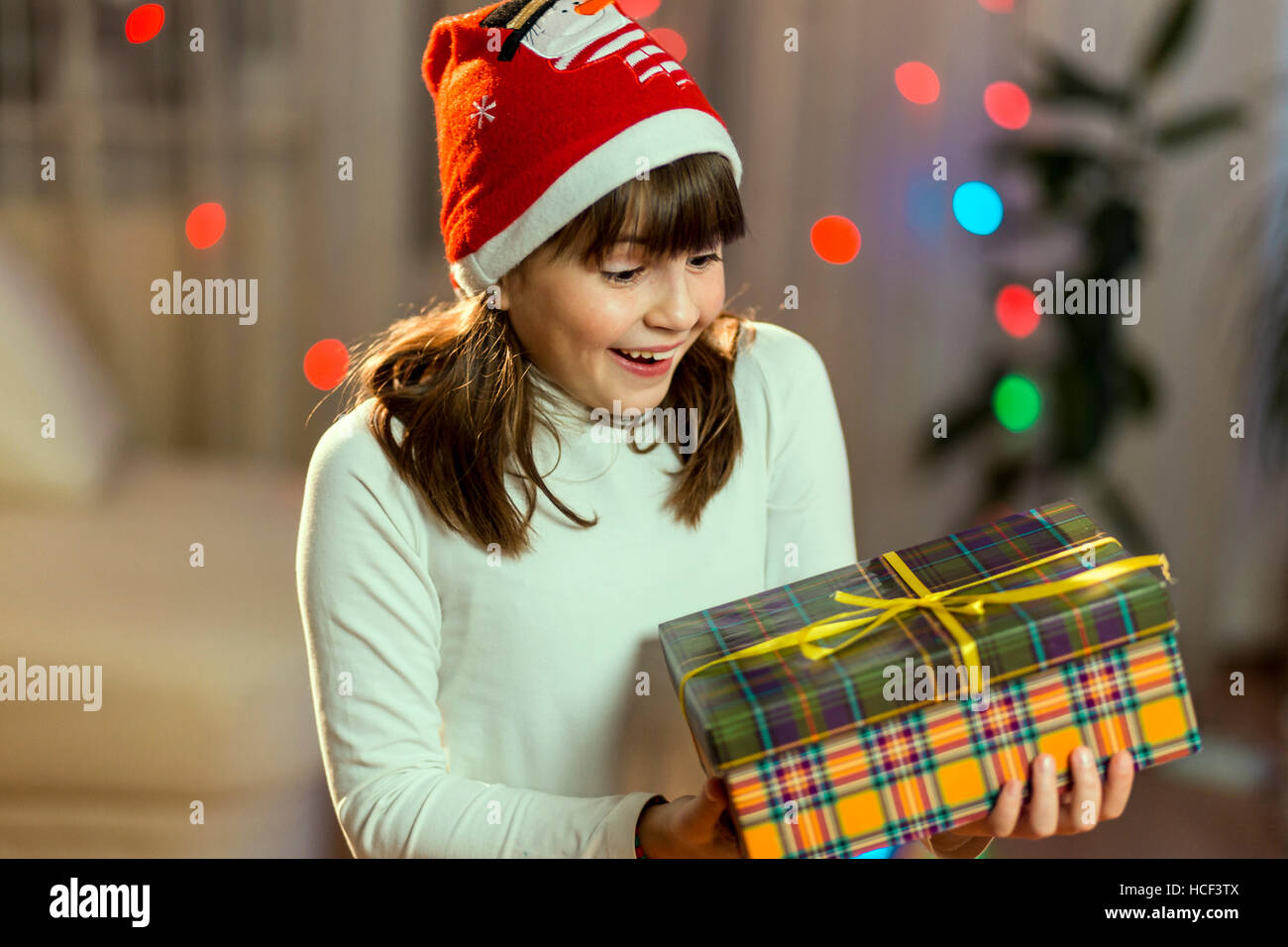 Young Girl Have Got a Christmas Gift Stock Photo - Alamy