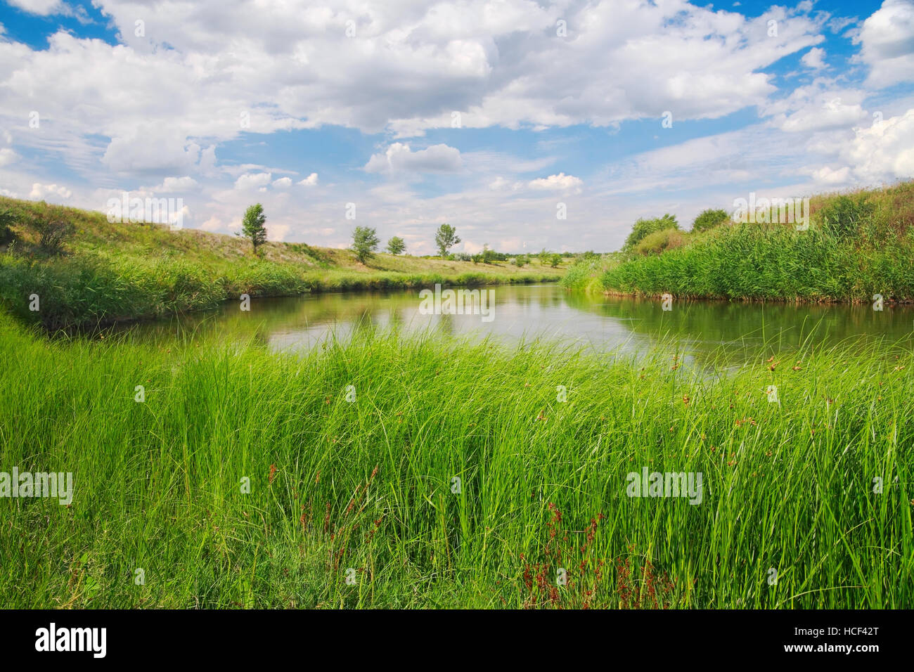 Countryside landscape, river coast Ingulets against the sky with clouds ...