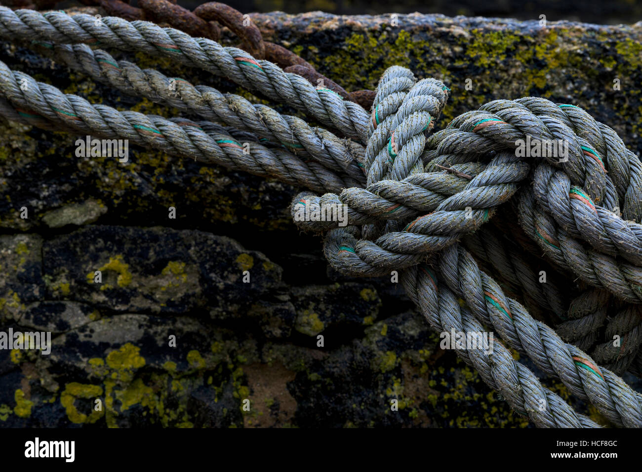 Thick, weathered rope tied at Polkerris Hatbour for boat mooring Stock ...