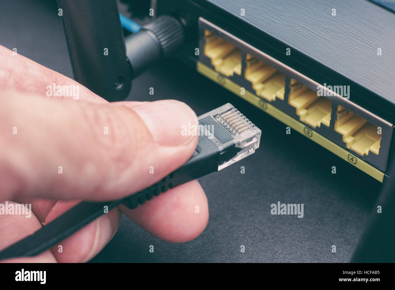 Close up hand plugging ethernet hi-res stock photography and images - Alamy