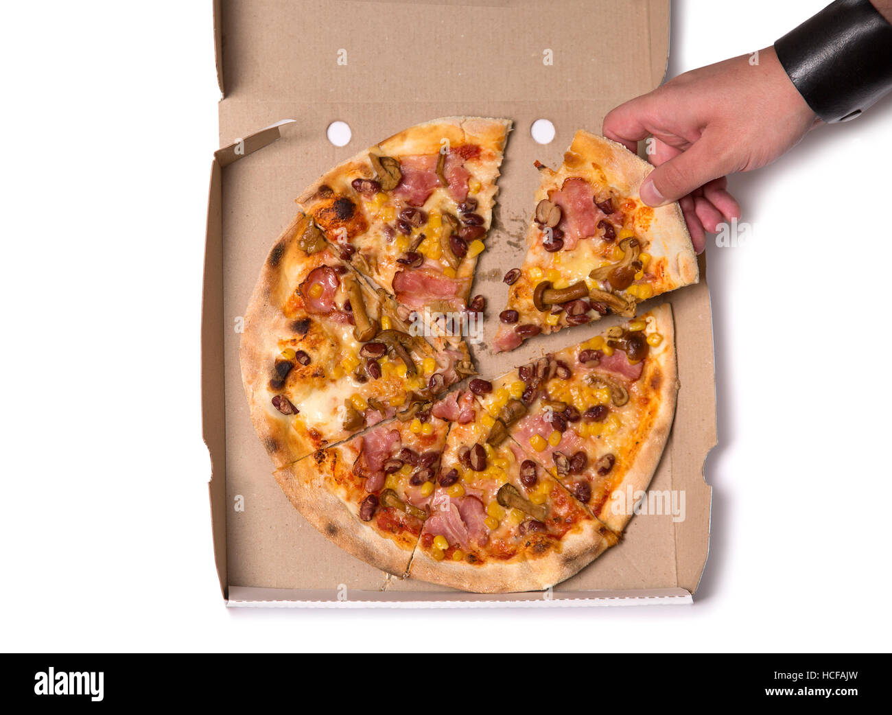 Male hand picking pizza slice, top view isolated on white background ...