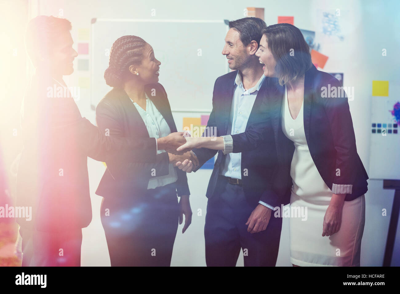 Group of happy businesspeople shaking hands Stock Photo - Alamy