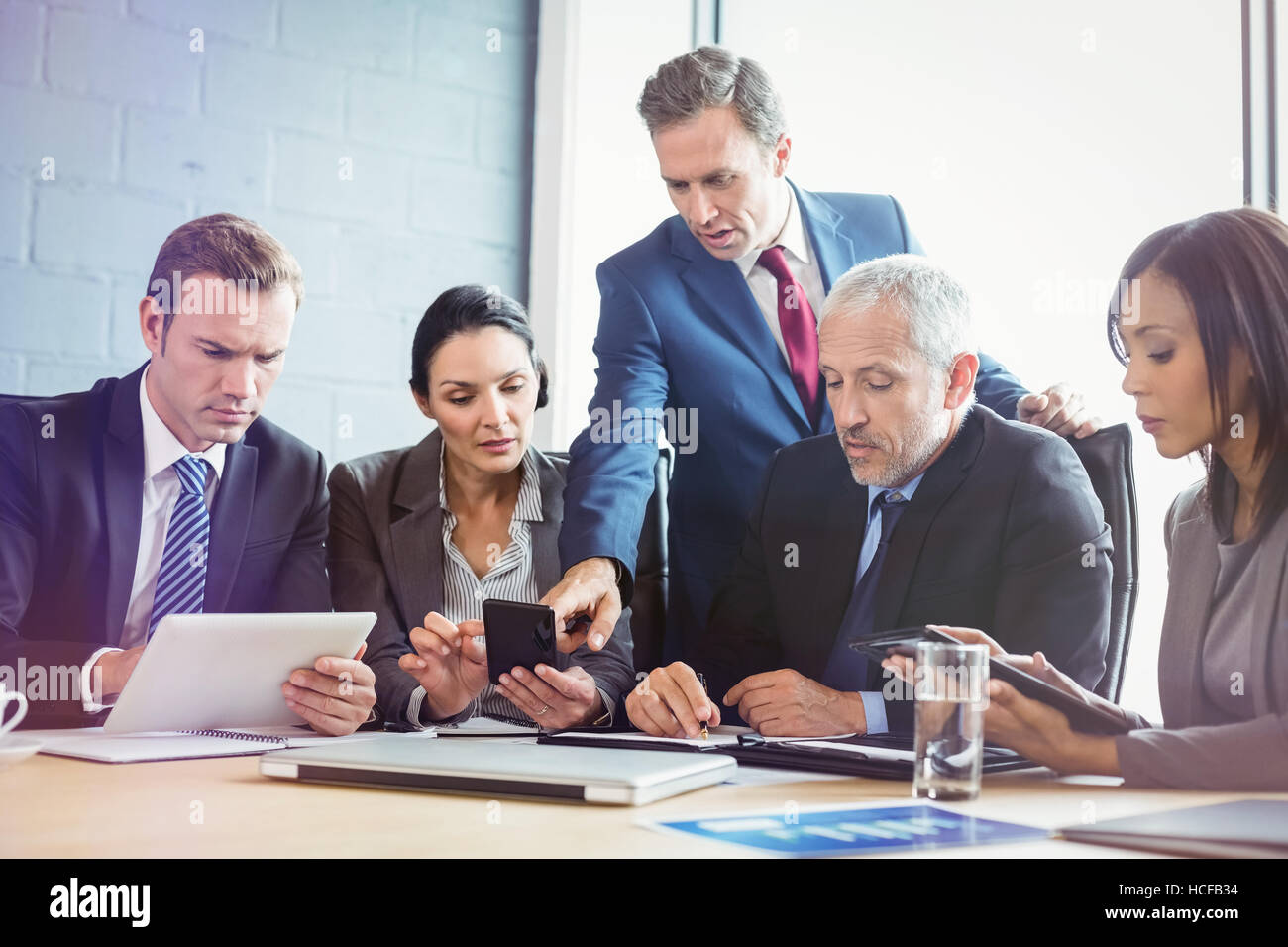 Business people having meeting in conference room Stock Photo - Alamy