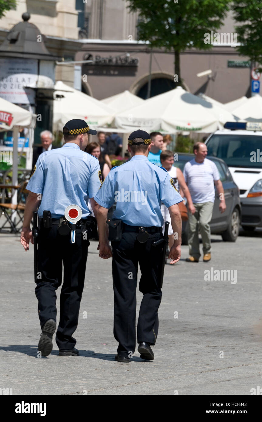A couple of Police officers patrolling Kraków Old Town square, an ...
