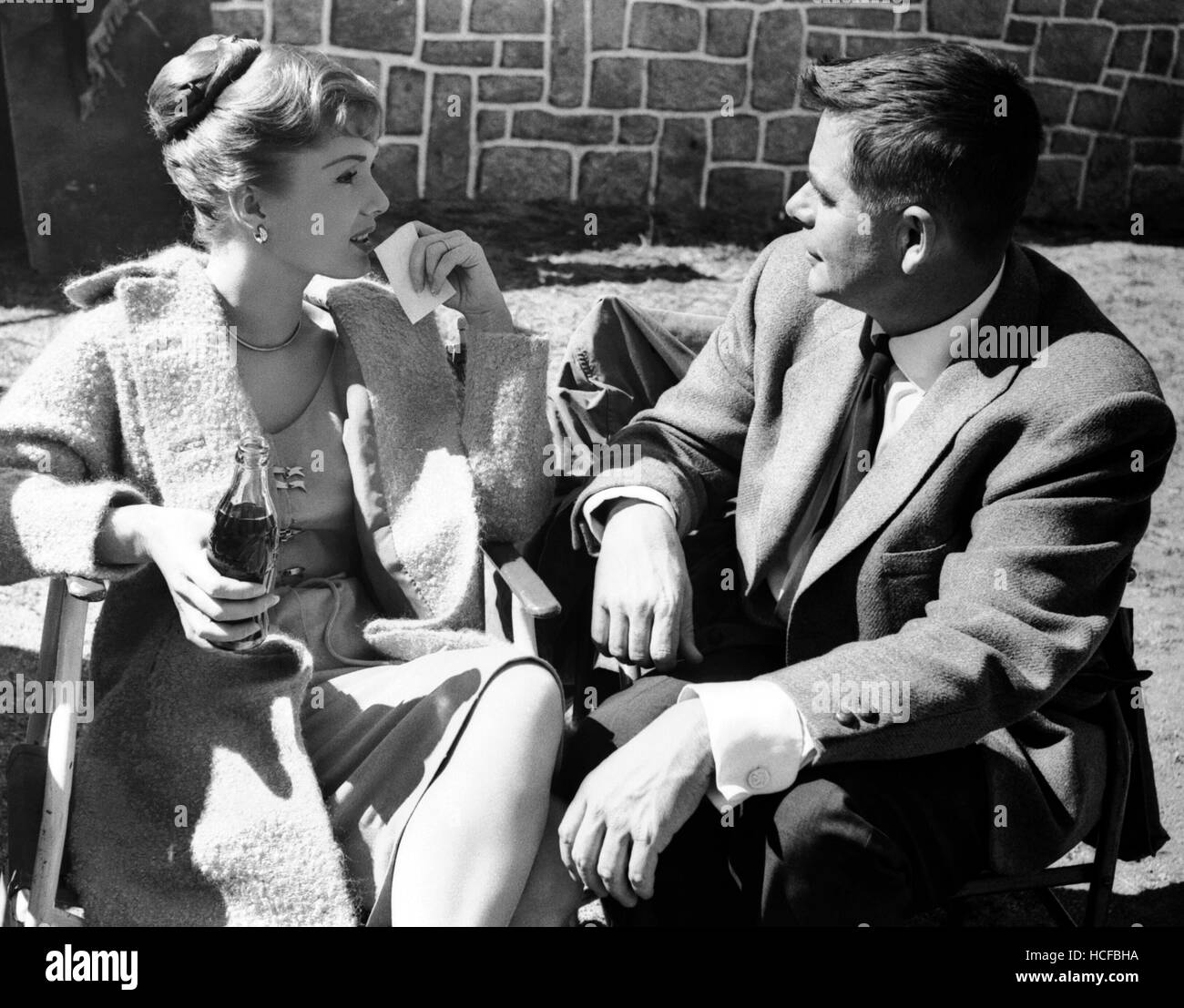 IT STARTED WITH A KISS, from left: Debbie Reynolds, Glenn Ford relaxing ...