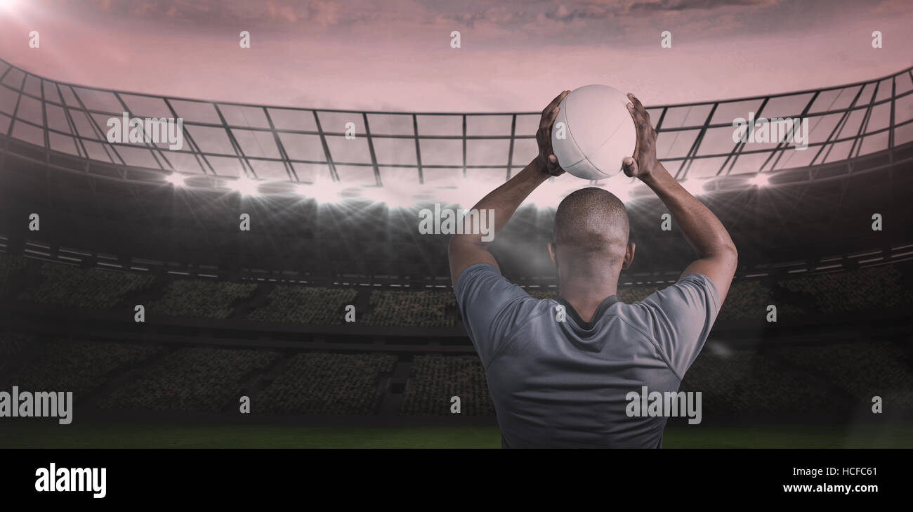 Composite image 3D of rear view of athlete throwing rugby ball Stock ...