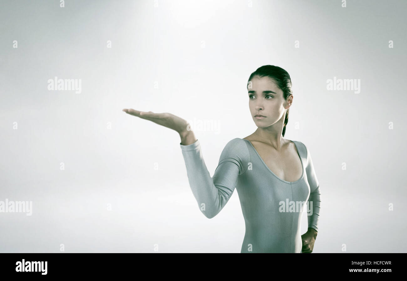 Composite image of young woman gesturing against white background Stock ...