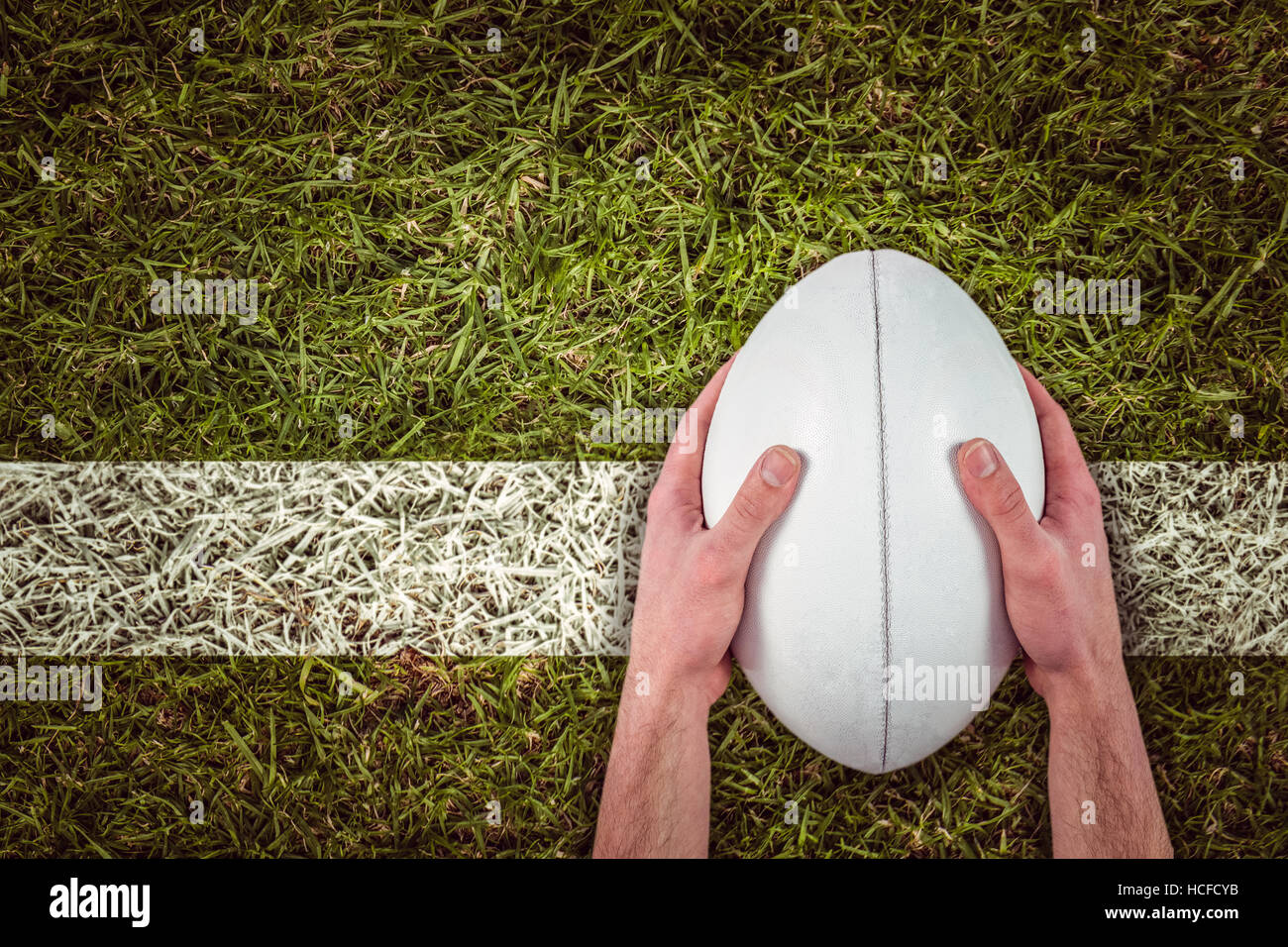 Composite image of rugby player catching a rugby ball Stock Photo - Alamy