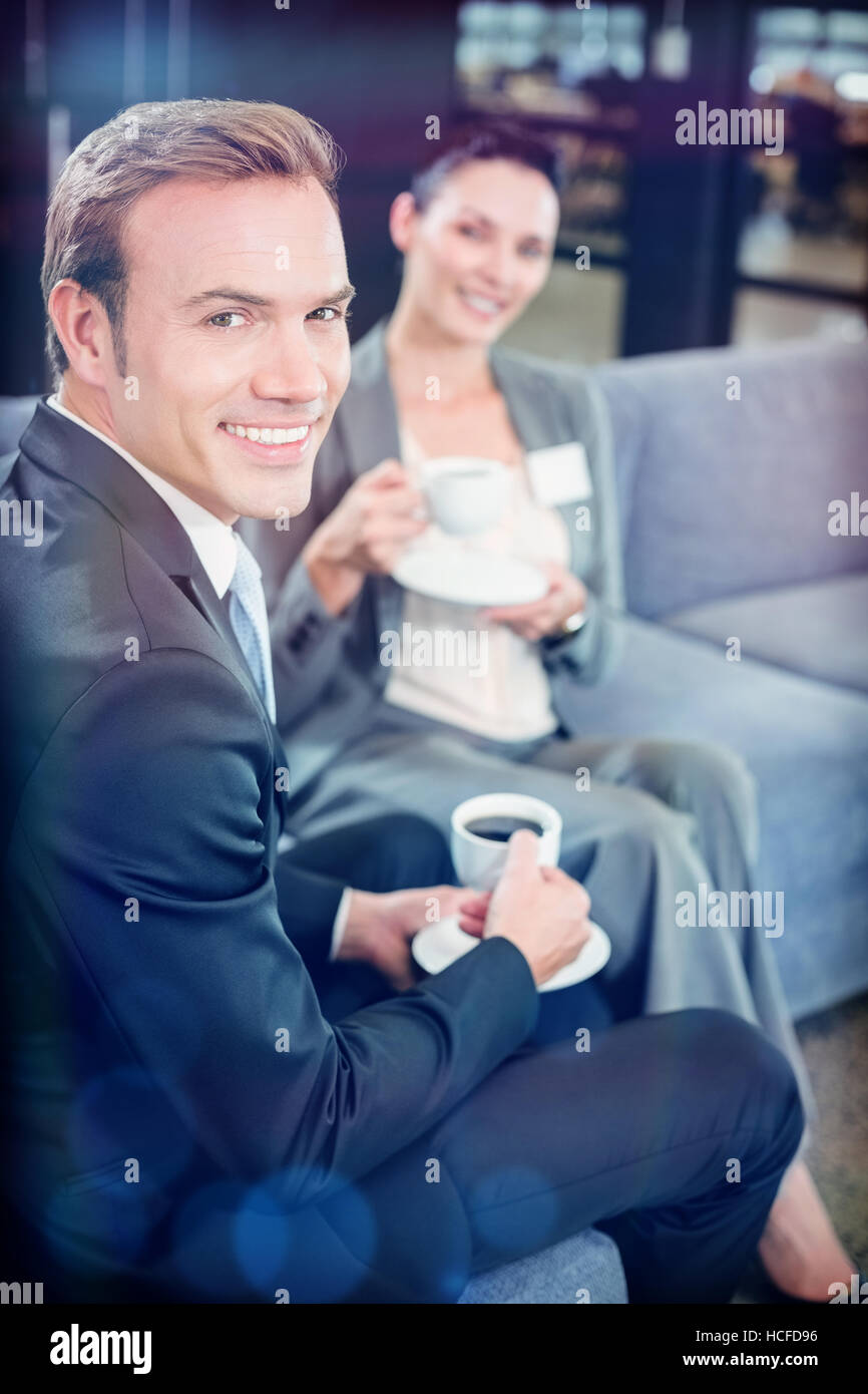 Businessman and businesswoman having tea during breaktime Stock Photo ...