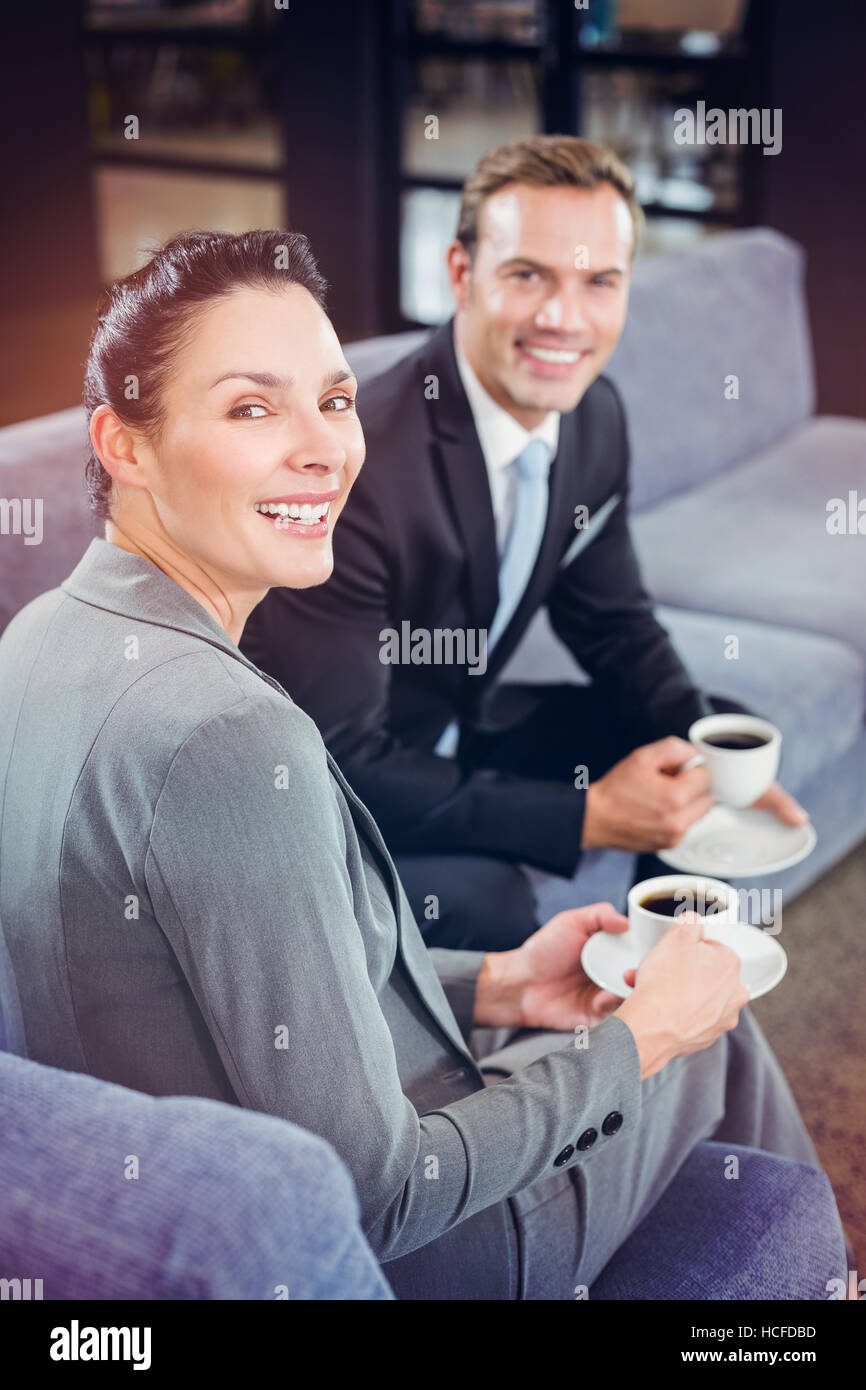 Businessman and businesswoman having tea during breaktime Stock Photo ...