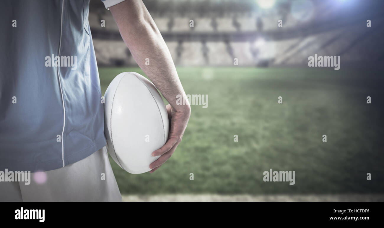 Composite image of serious rugby player with arms crossed Stock Photo ...