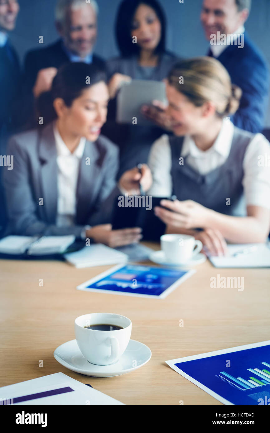 Cup of coffee on table in conference room Stock Photo - Alamy
