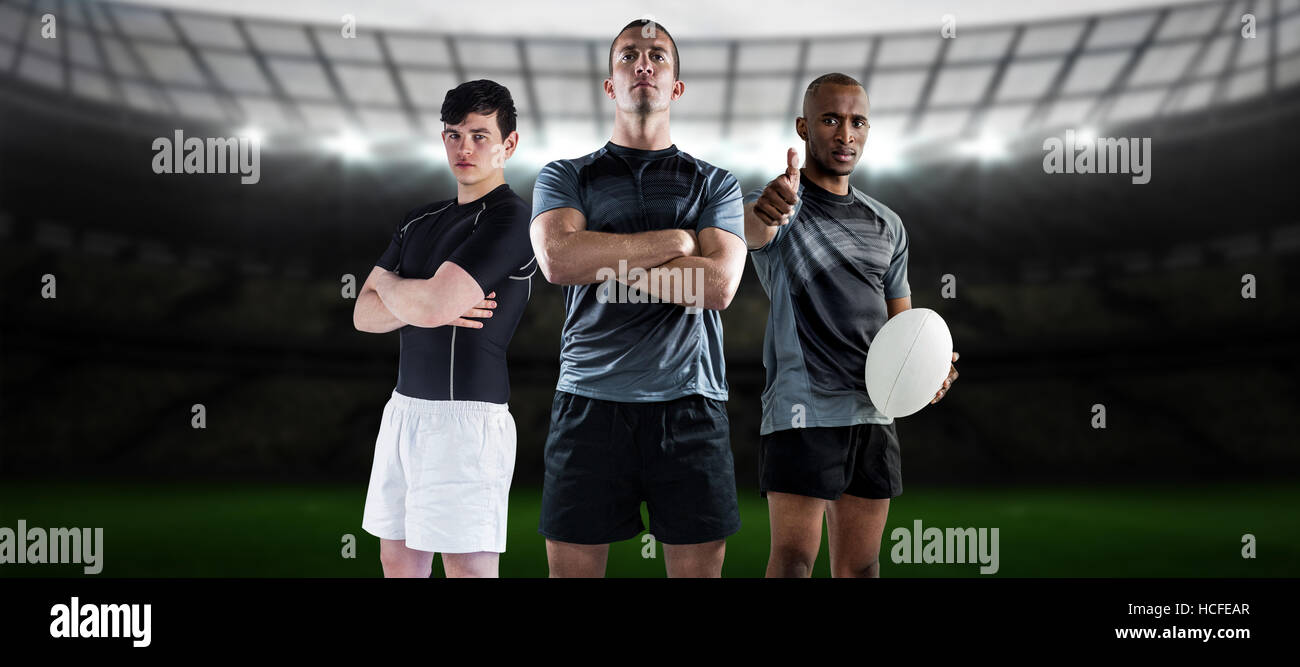Composite image of tough rugby players Stock Photo - Alamy