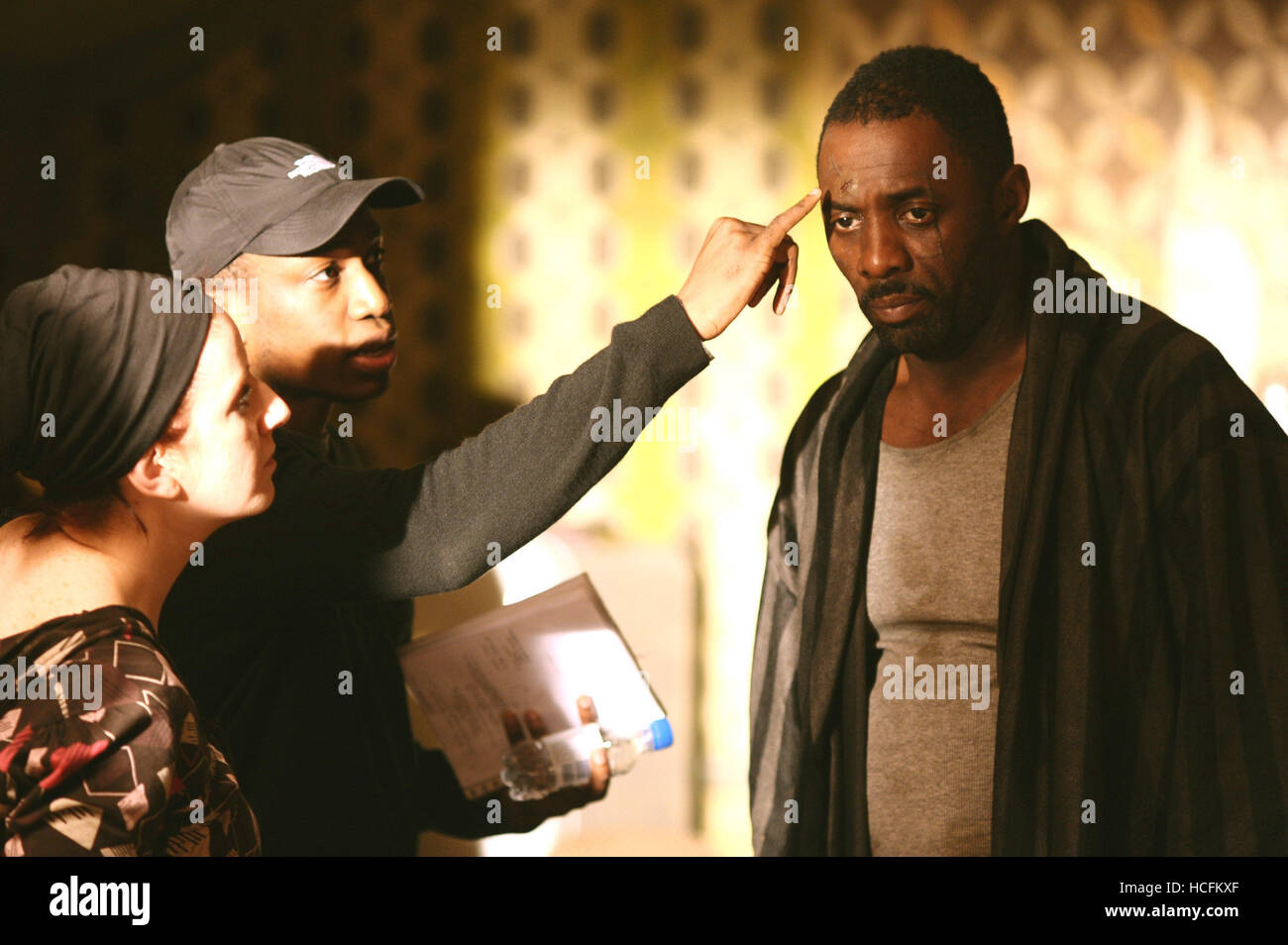 LEGACY, director Thomas Ikimi (center), Idris Elba (right), on set ...