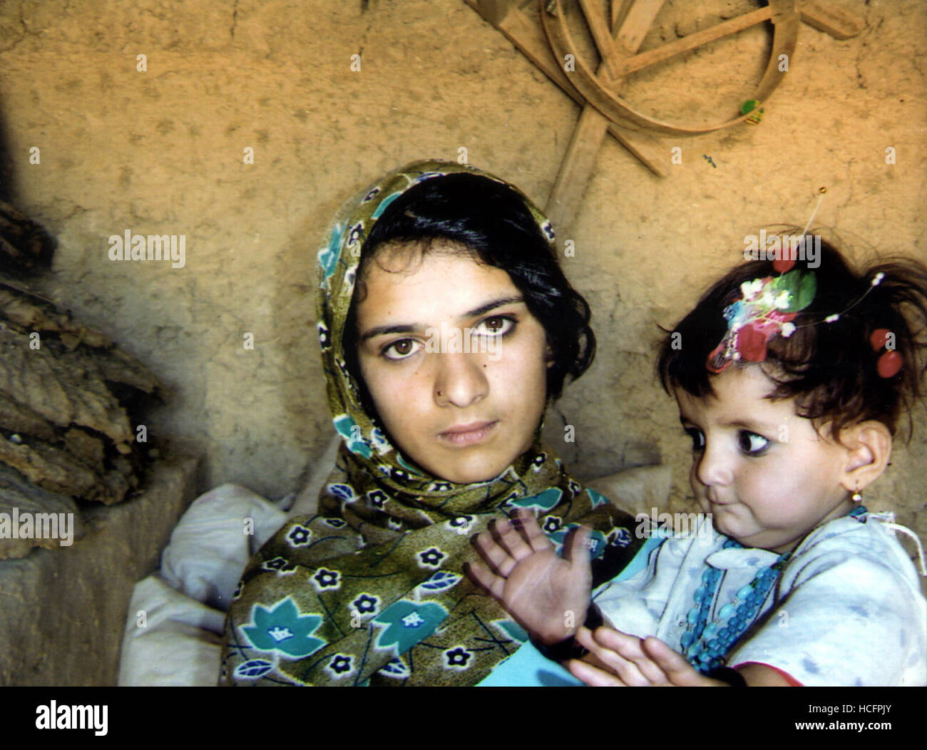 LIFTING THE VEIL, Afghan mother Najeeba with son, 2002 Stock Photo - Alamy