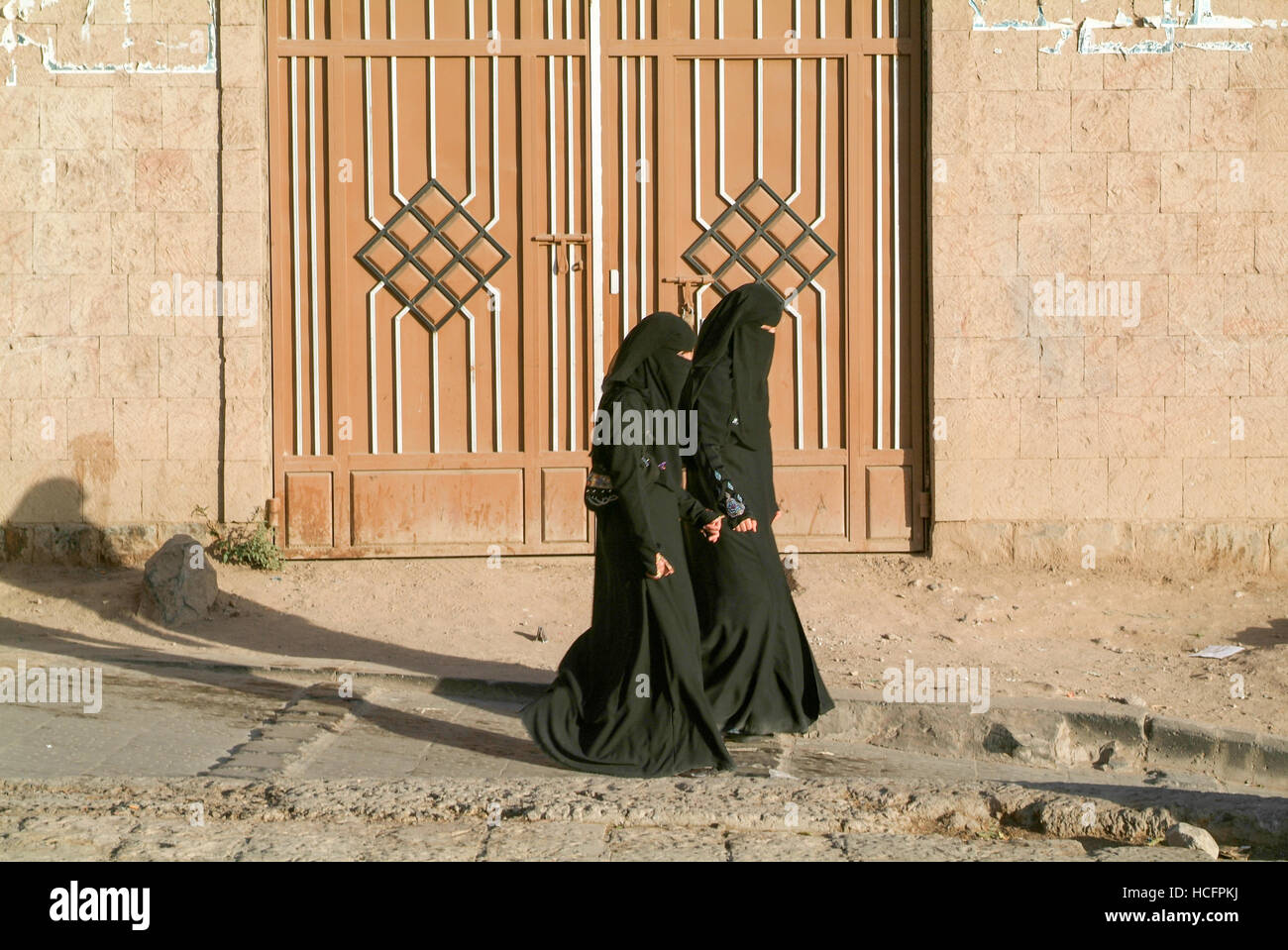 Sana, Yemen - 3 January 2008: women wearing the burqa and walking on ...