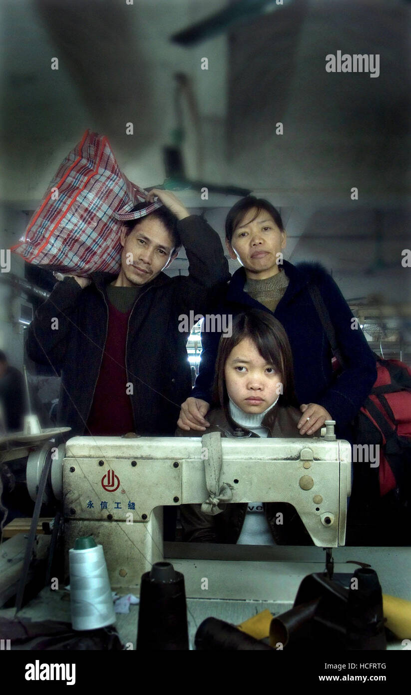 LAST TRAIN HOME, ZHANG Qin (bottom) with her parents, from left: ZHAN ...