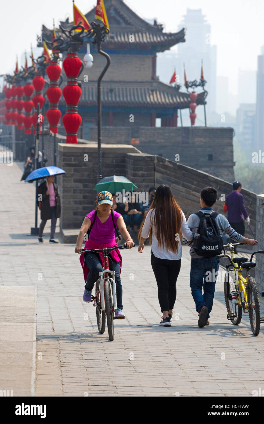 Tourists on bicycles at Xian city walls, Shaanxi, China Stock Photo - Alamy