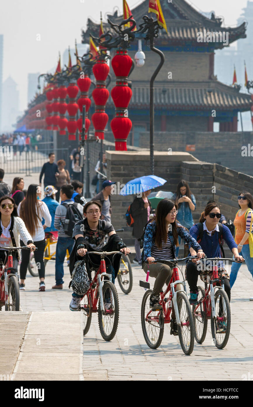 Tourists on bicycles at Xian city walls, Shaanxi, China Stock Photo - Alamy