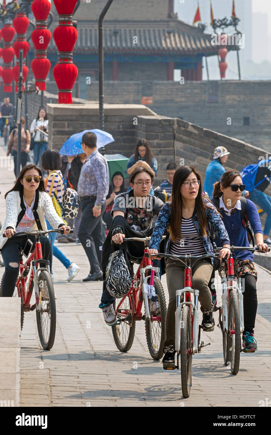 Tourists on bicycles at Xian city walls, Shaanxi, China Stock Photo - Alamy