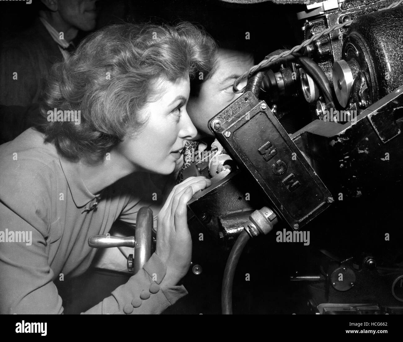 THE MINIVER STORY, Greer Garson looking through the camera on set, 1950 ...