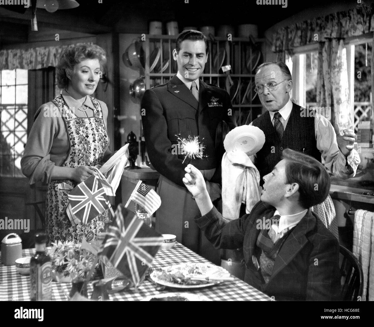 THE MINIVER STORY, Greer Garson, Walter Pidgeon (c.), James Fox (seated ...